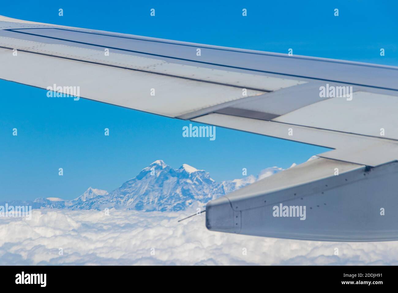 Nepal Airline aircraft wing, flight above Mount Everest in the ...