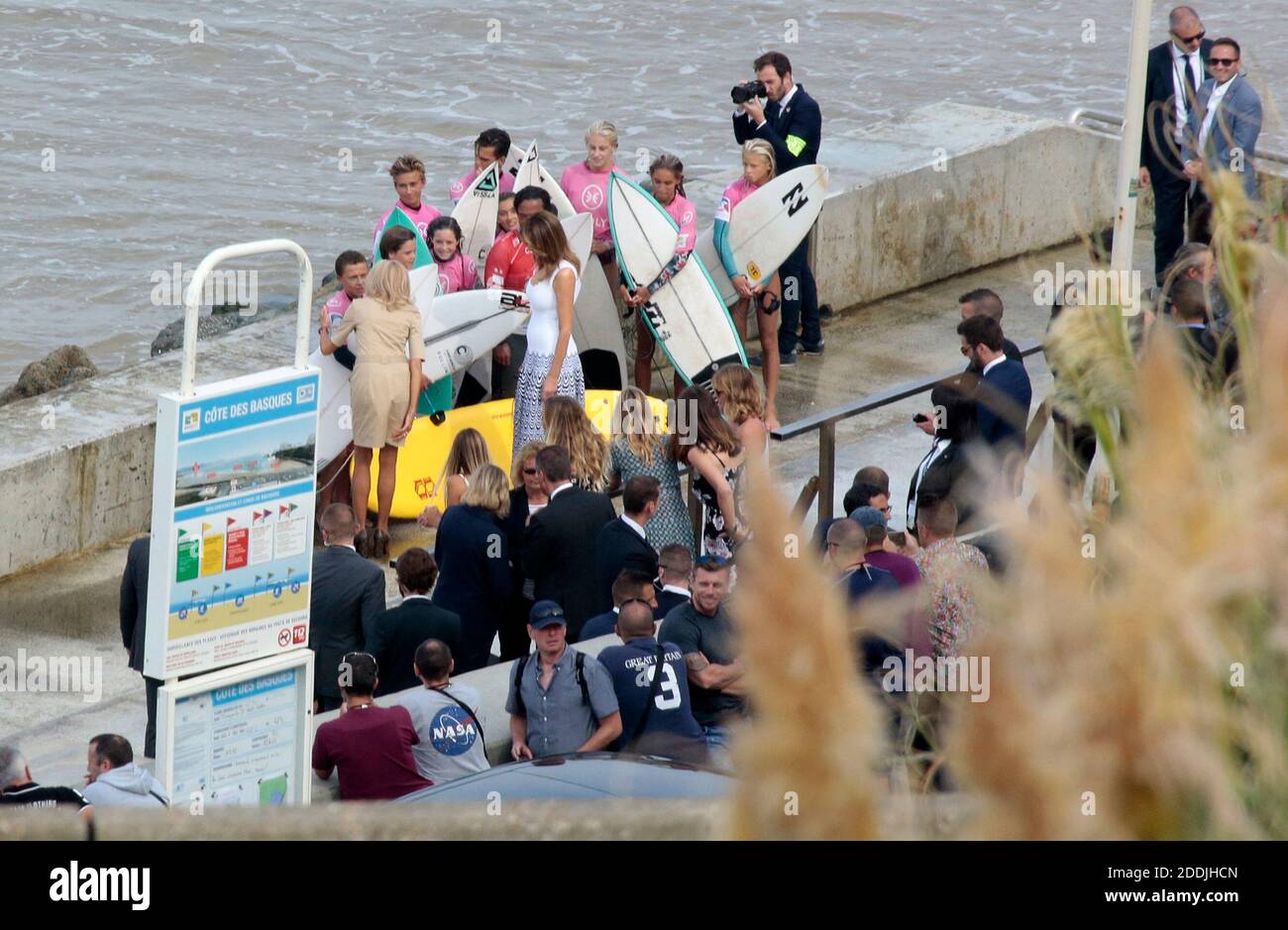Brigitte Macron, Melania Trump and other leaders’ spouses watch a surf ...