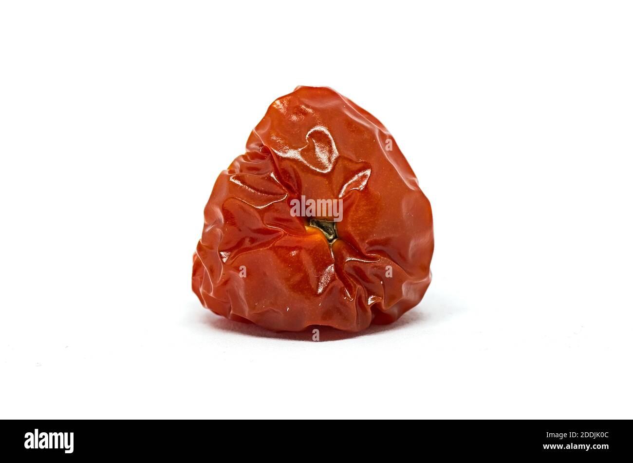 Rotten red cherry tomato on whote background. Studio shot of a ...