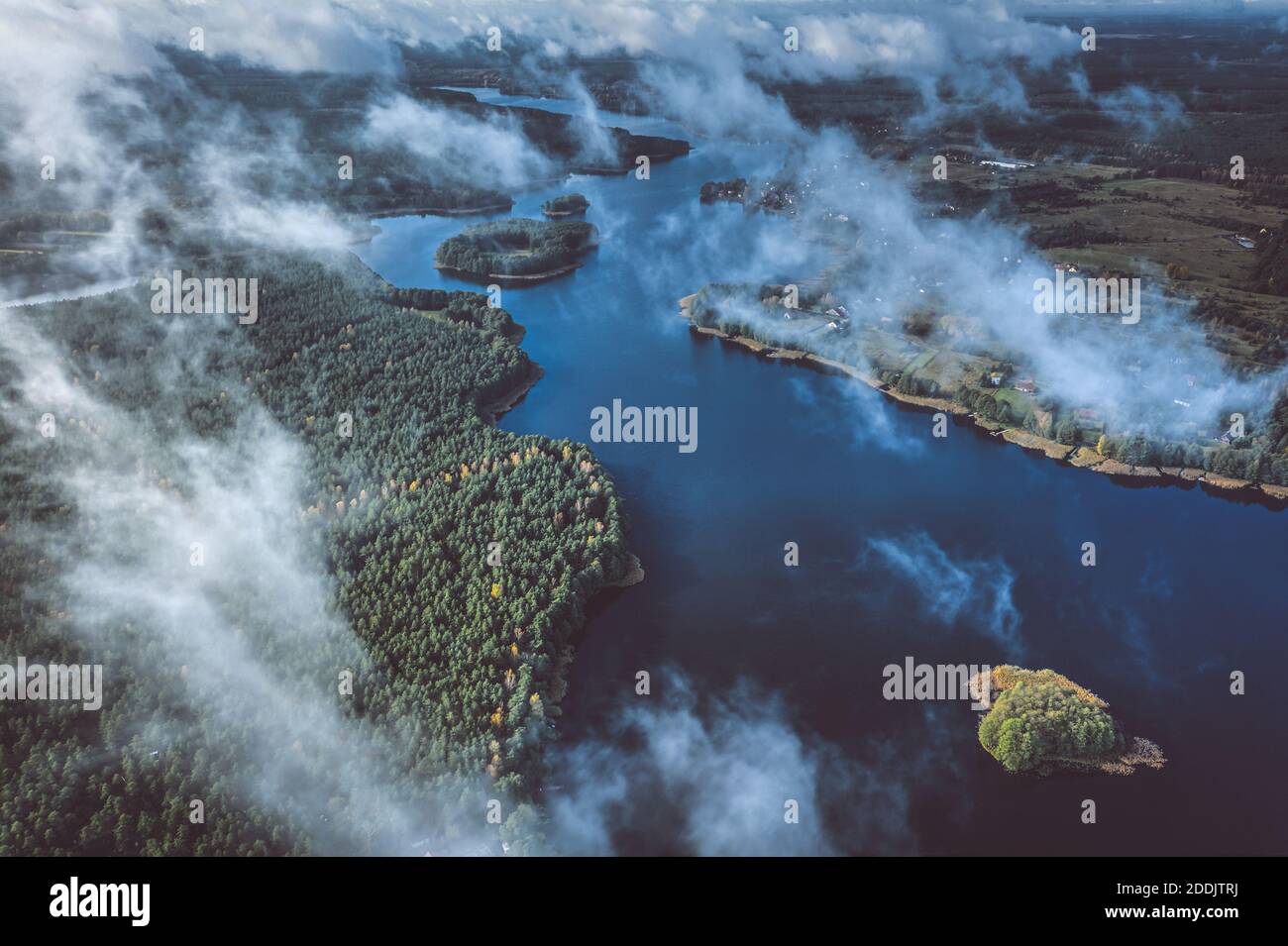 Aerial view of lake and clouds below Stock Photo - Alamy