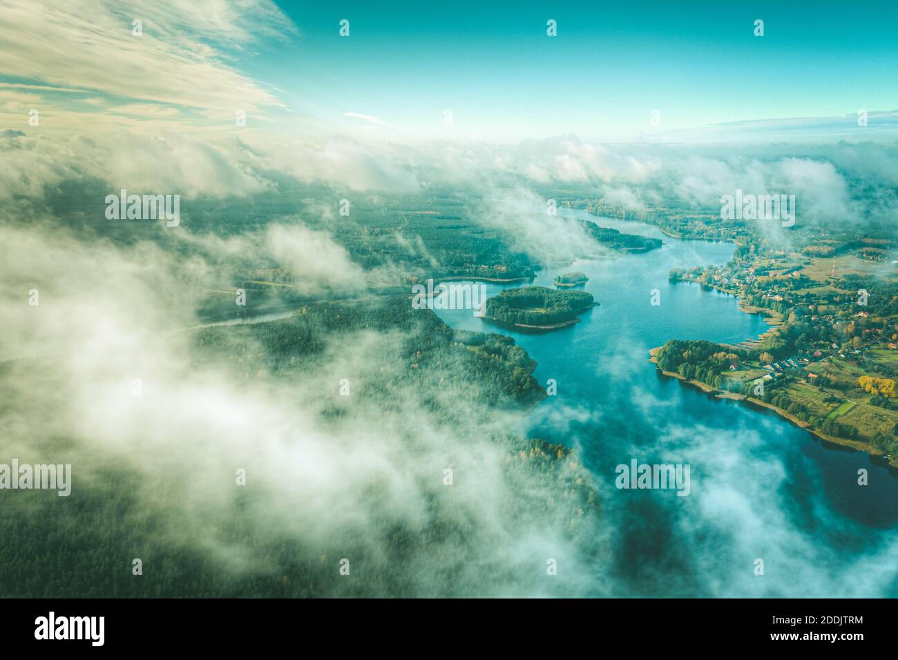 Aerial view of lake and clouds below Stock Photo - Alamy