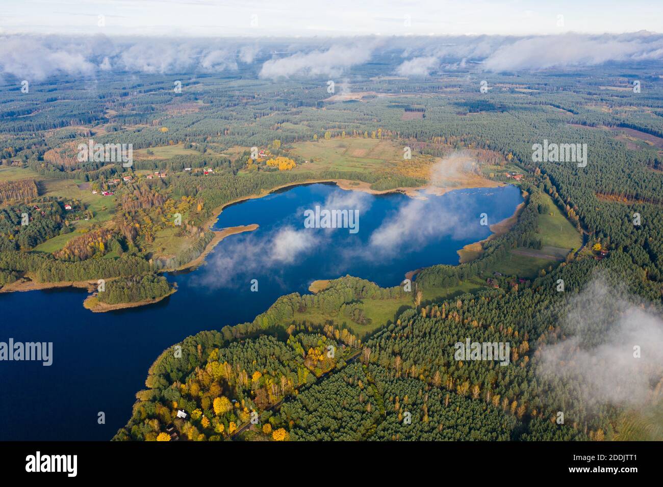 Aerial view of lake and clouds below Stock Photo - Alamy