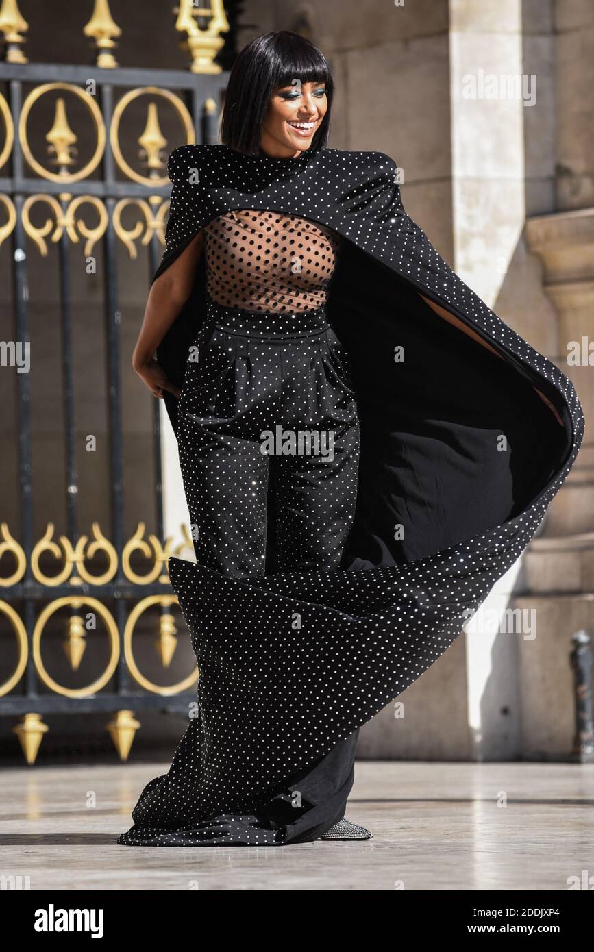 Kat Graham poses before the runway during the Balmain Womenswear Spring ...