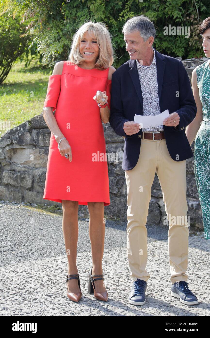 Brigitte Macron, wife of French President Emmanuel Macron wait for the ...