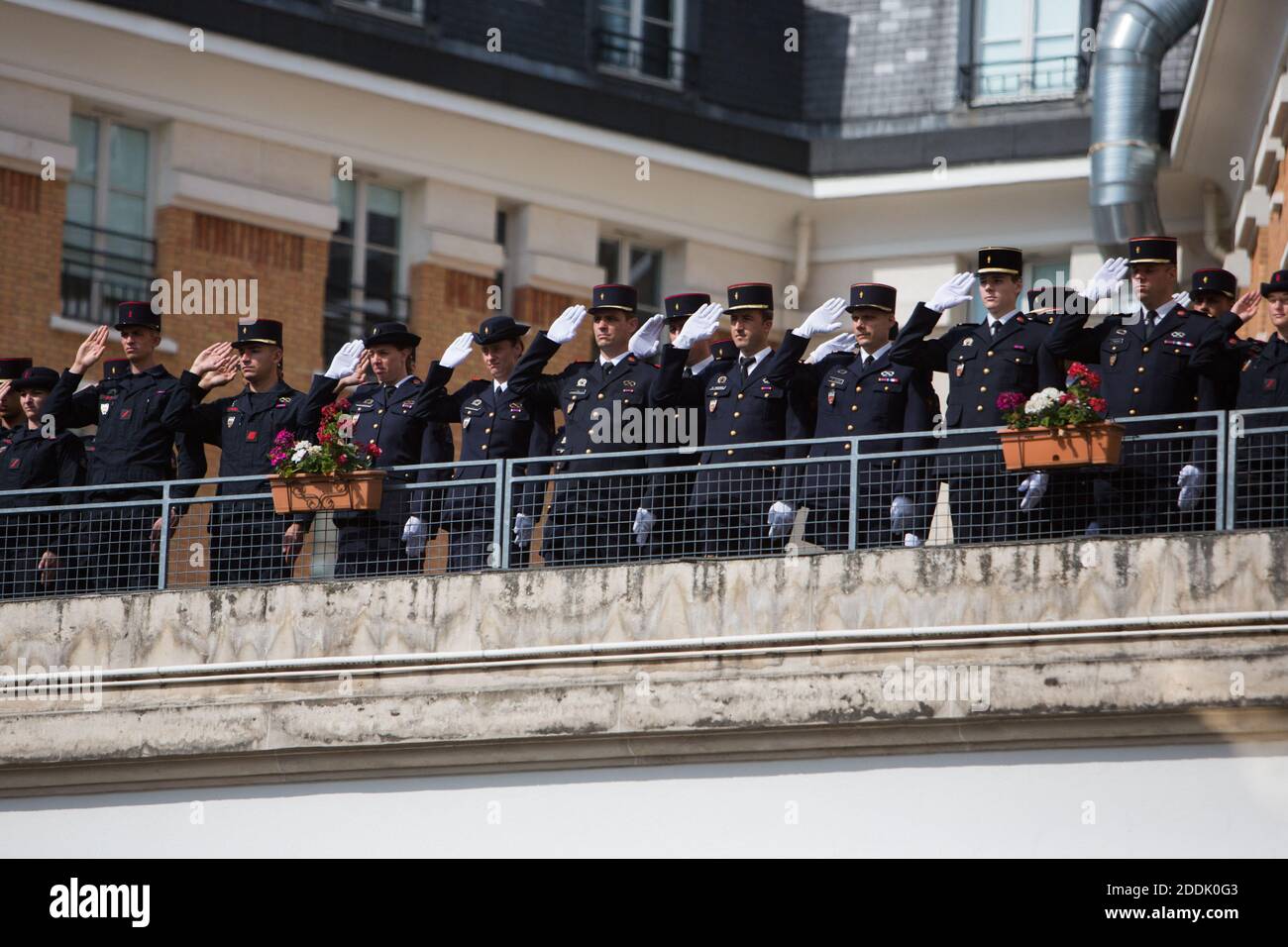 Firefighters in ceremonial uniform stand to attention during the ...
