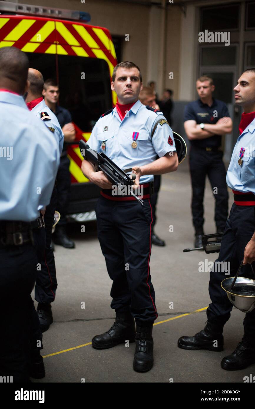 Firefighters in ceremonial uniform gives their weapon (FAMAS) back ...