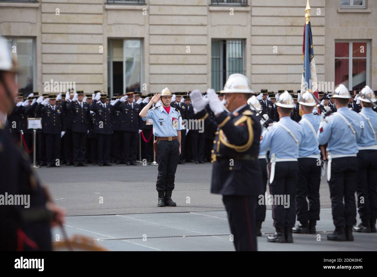 Firefighters in ceremonial uniform stand to attention during the ...