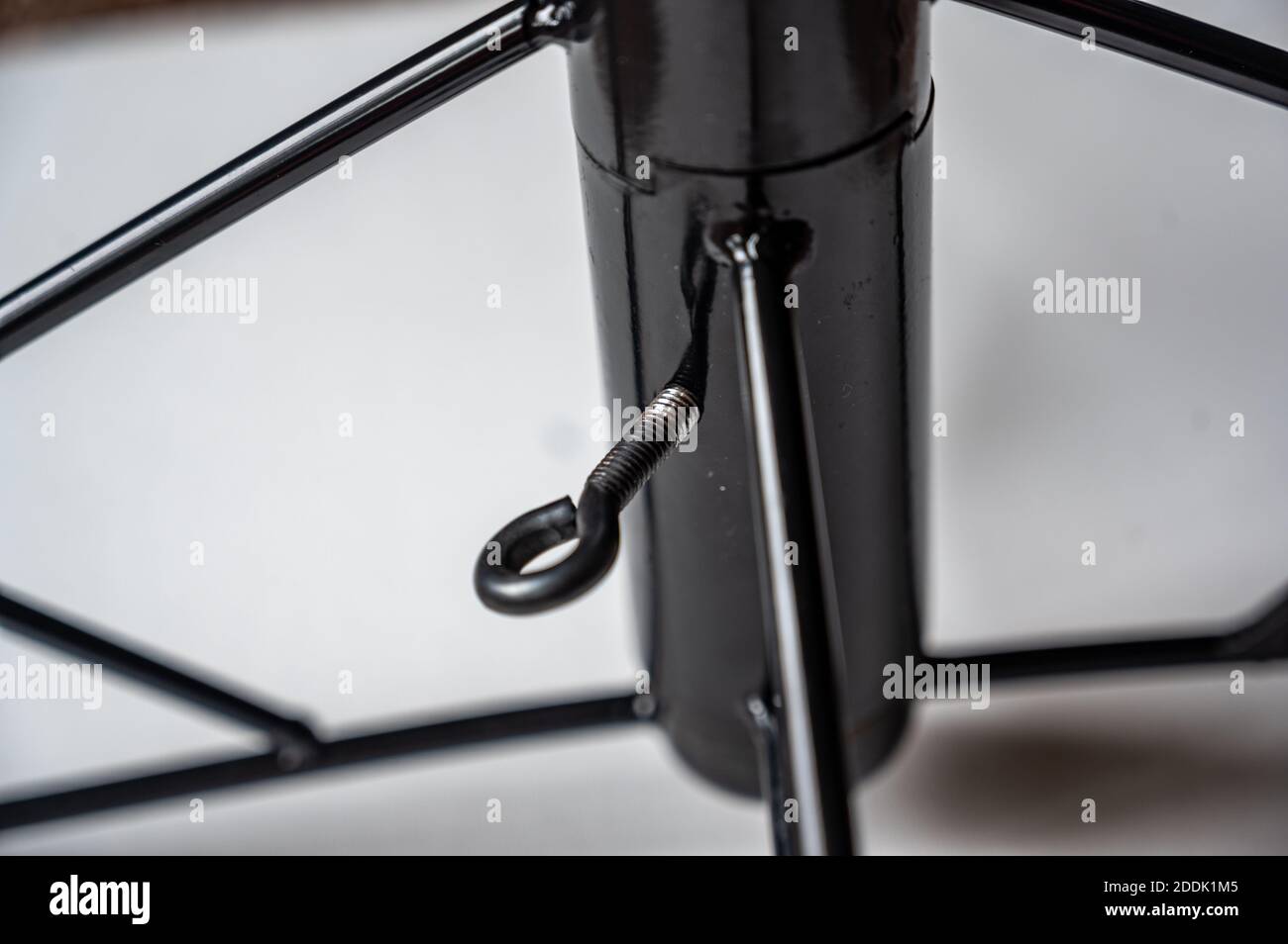 Metal support with tension screw to hold tree in place Stock Photo - Alamy