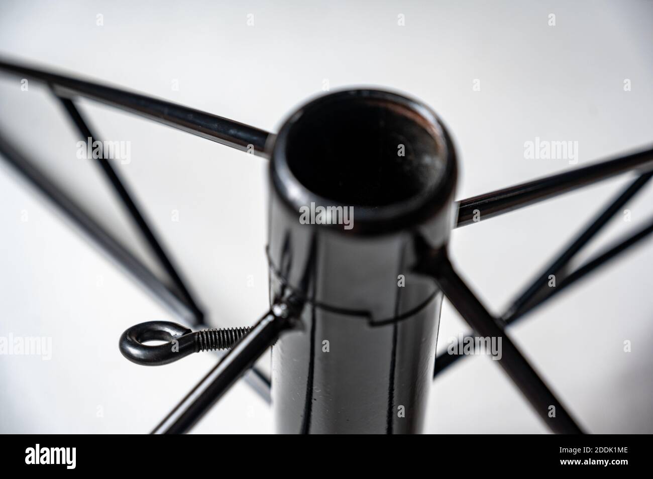 Metal support with tension screw to hold tree in place Stock Photo - Alamy