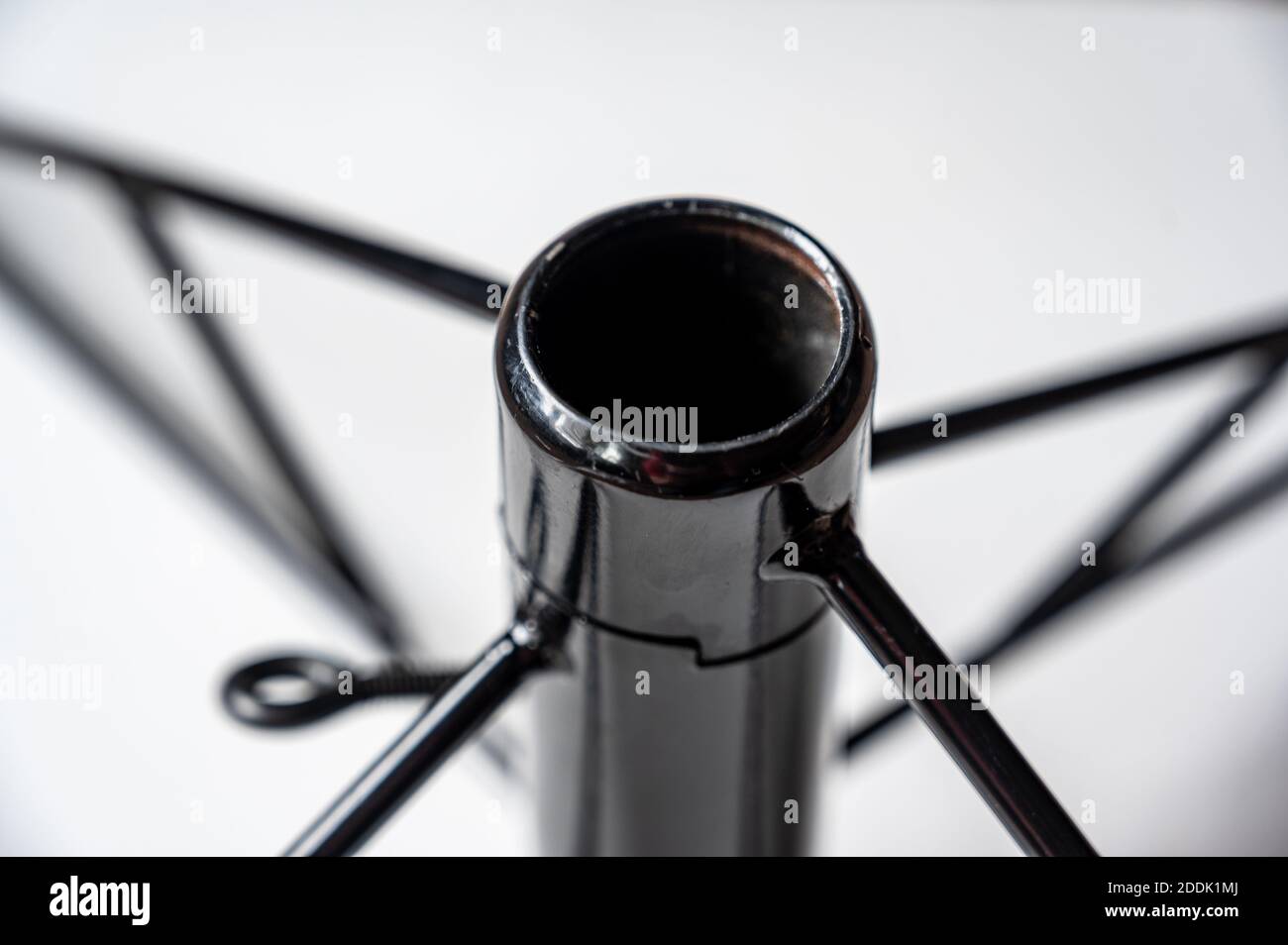 Metal support with tension screw to hold tree in place Stock Photo - Alamy