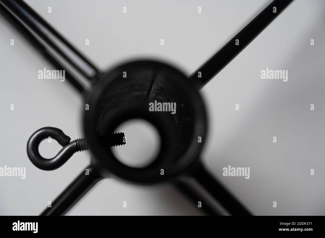 Metal support with tension screw to hold tree in place Stock Photo - Alamy