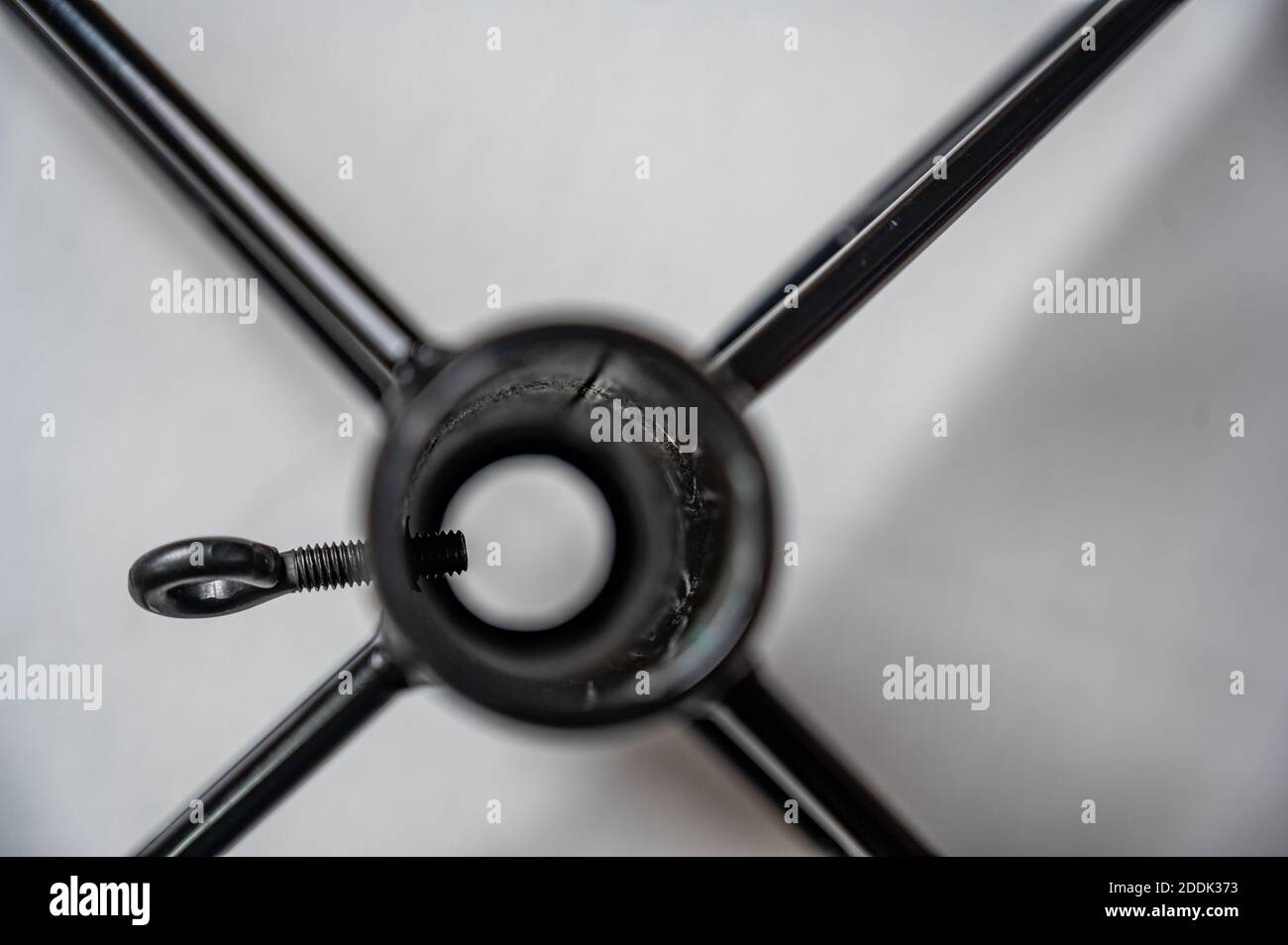 Metal support with tension screw to hold tree in place Stock Photo - Alamy