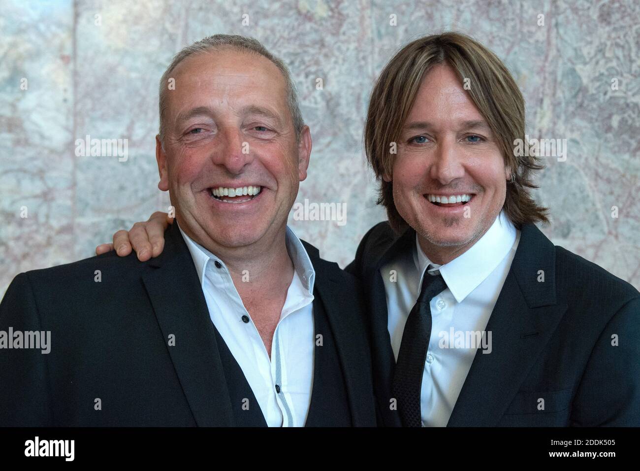 Tony Webb and Keith Urban attending the Giorgio Armani Prive show as ...