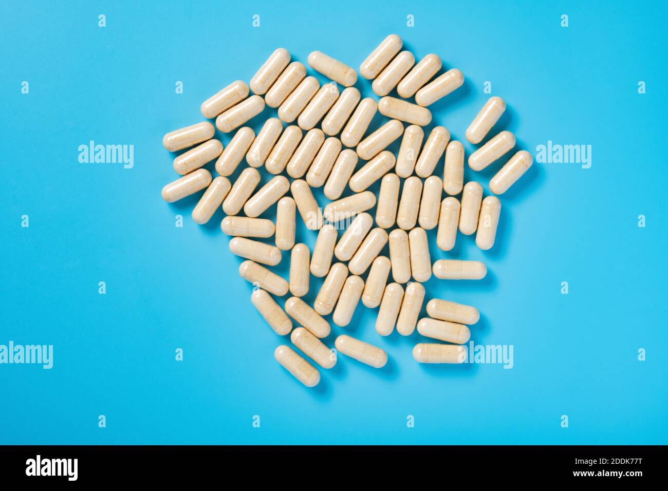top view capsules on a blue background Stock Photo - Alamy