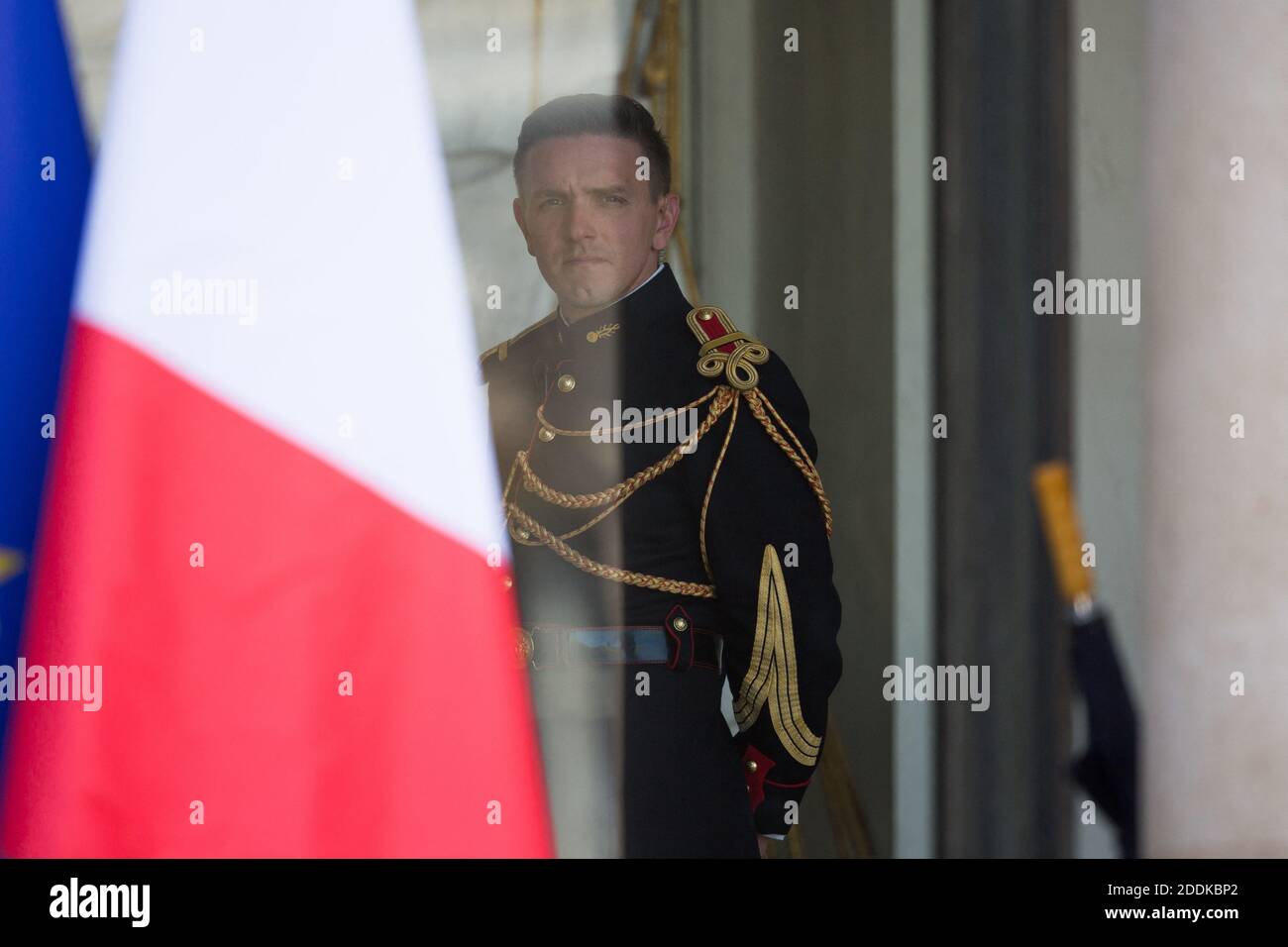 french national guard with a french flag during the weekly cabinet ...