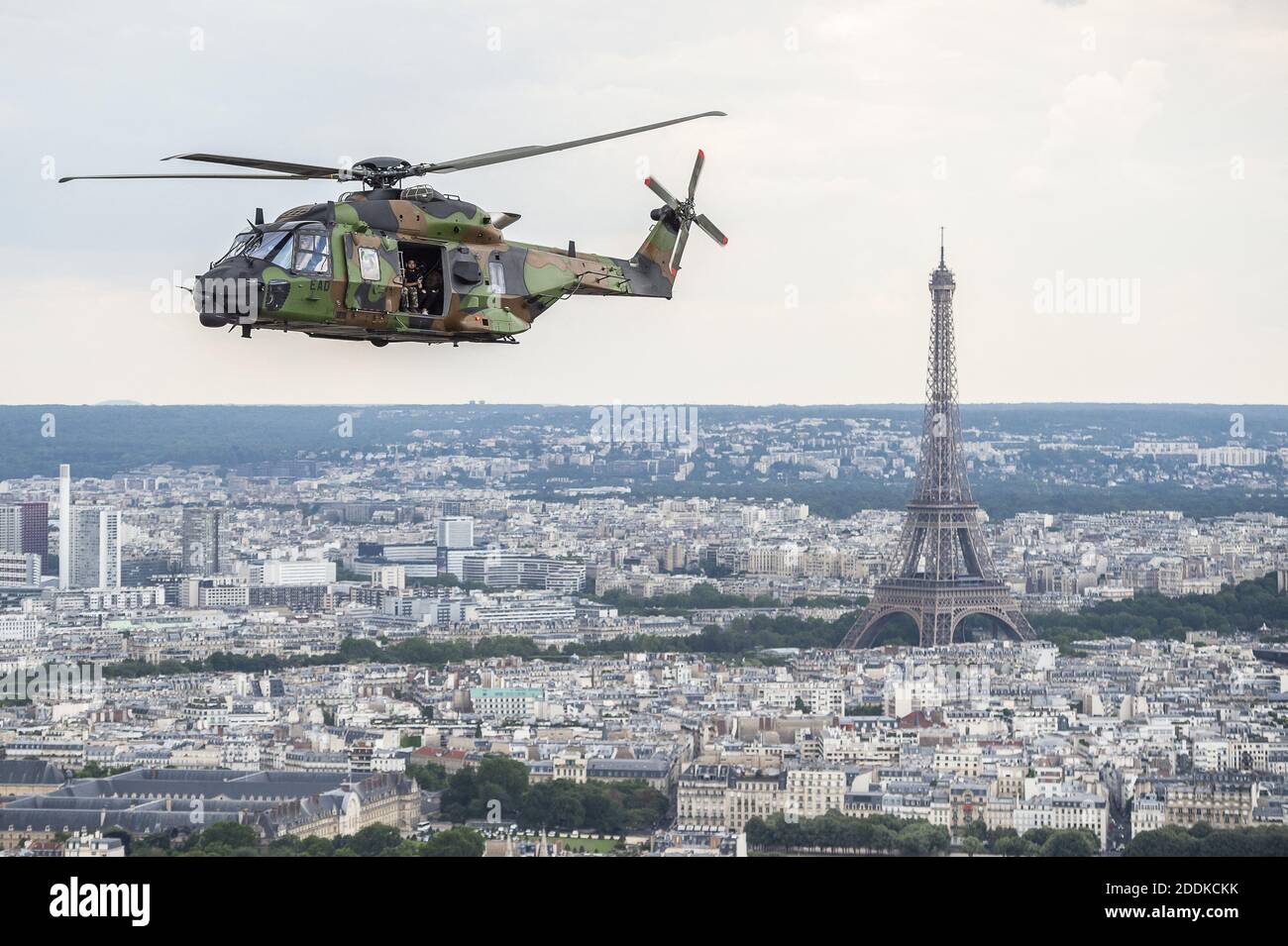 A picture taken on July 11, 2019 over Paris, France, shows a NH90 ...