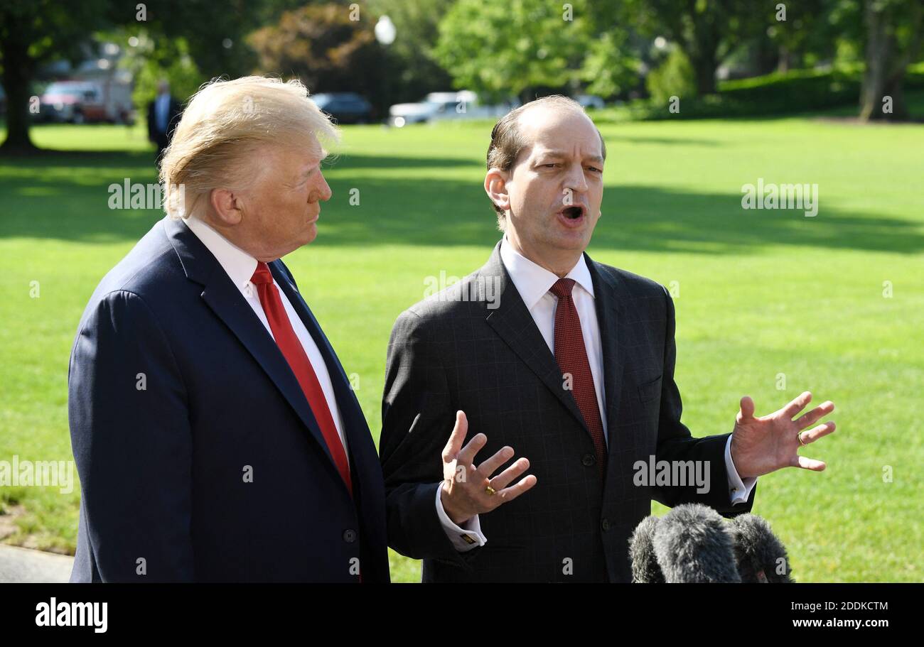 U.S. President Donald Trump stands with Labor Secretary Alex Acosta ...