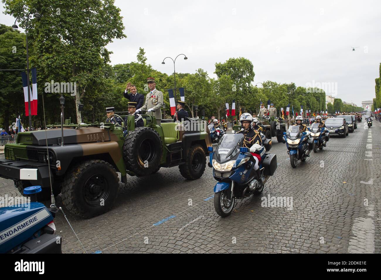 France's President Emmanuel Macron gestures in an Acmat VLRA vehicle ...