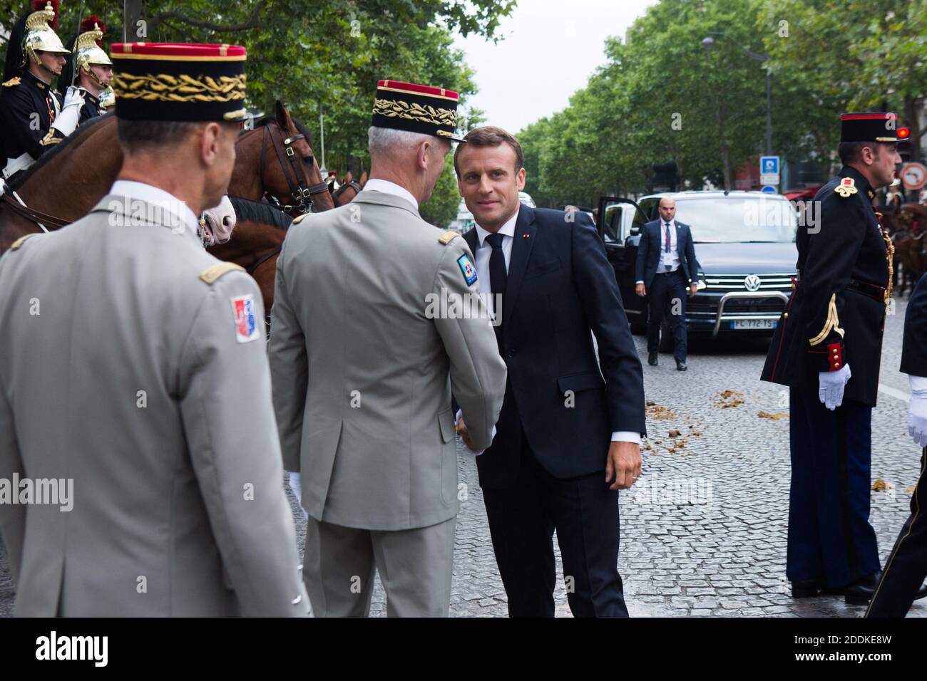 French President Emmanuel Macron arrives with Paris military governor ...