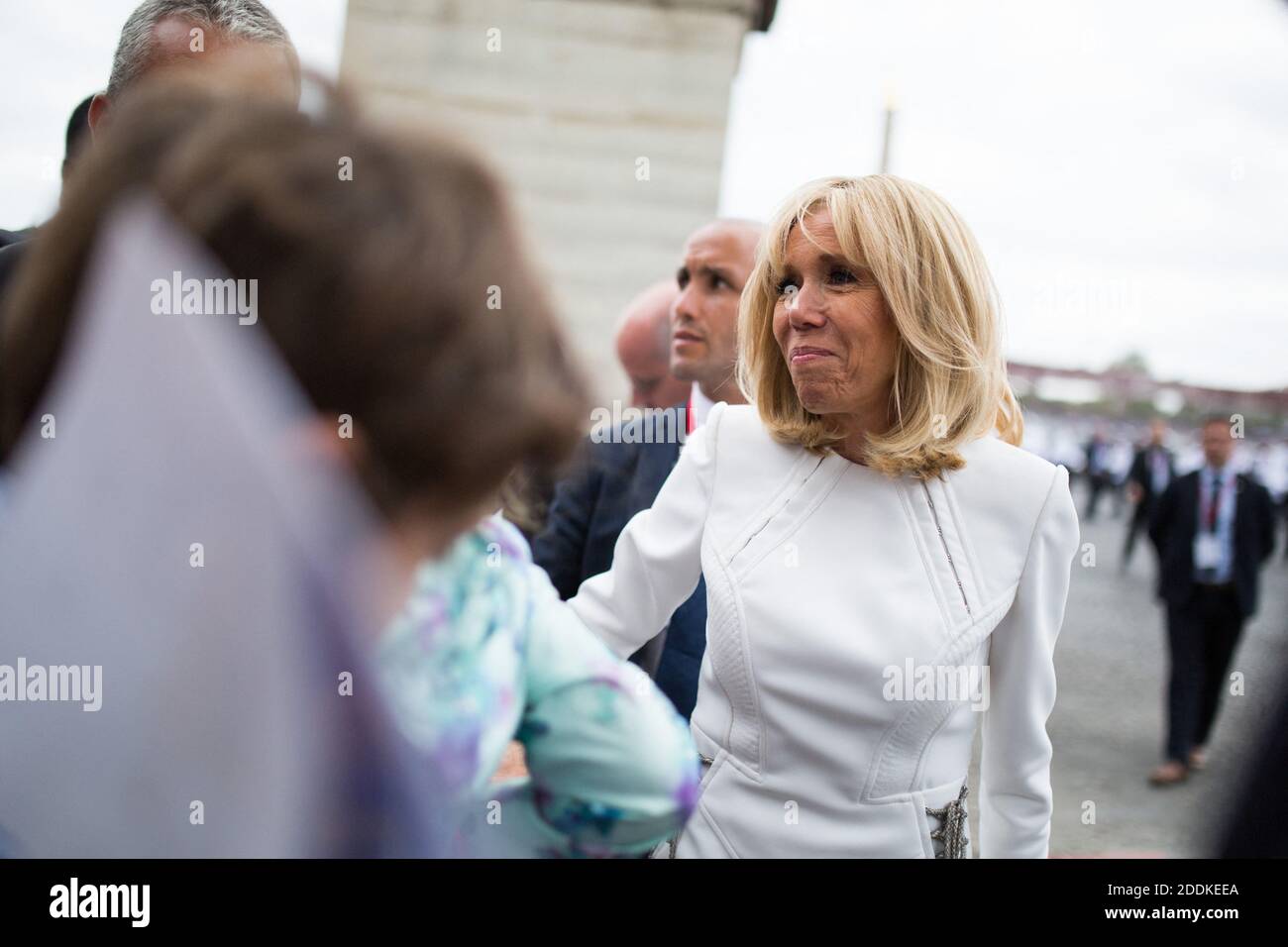 Brigitte Macron speaks with the public at the end of the annual ...
