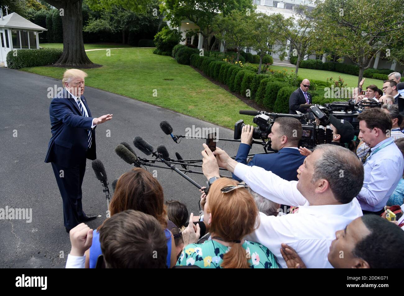 US President Donald Trump talks to the media on the South Lawn before ...
