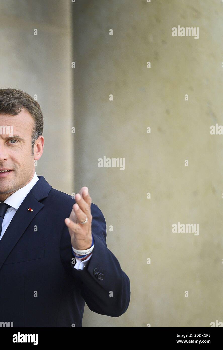 French President Emmanuel Macron gestures and smiles at Elysee Palace ...