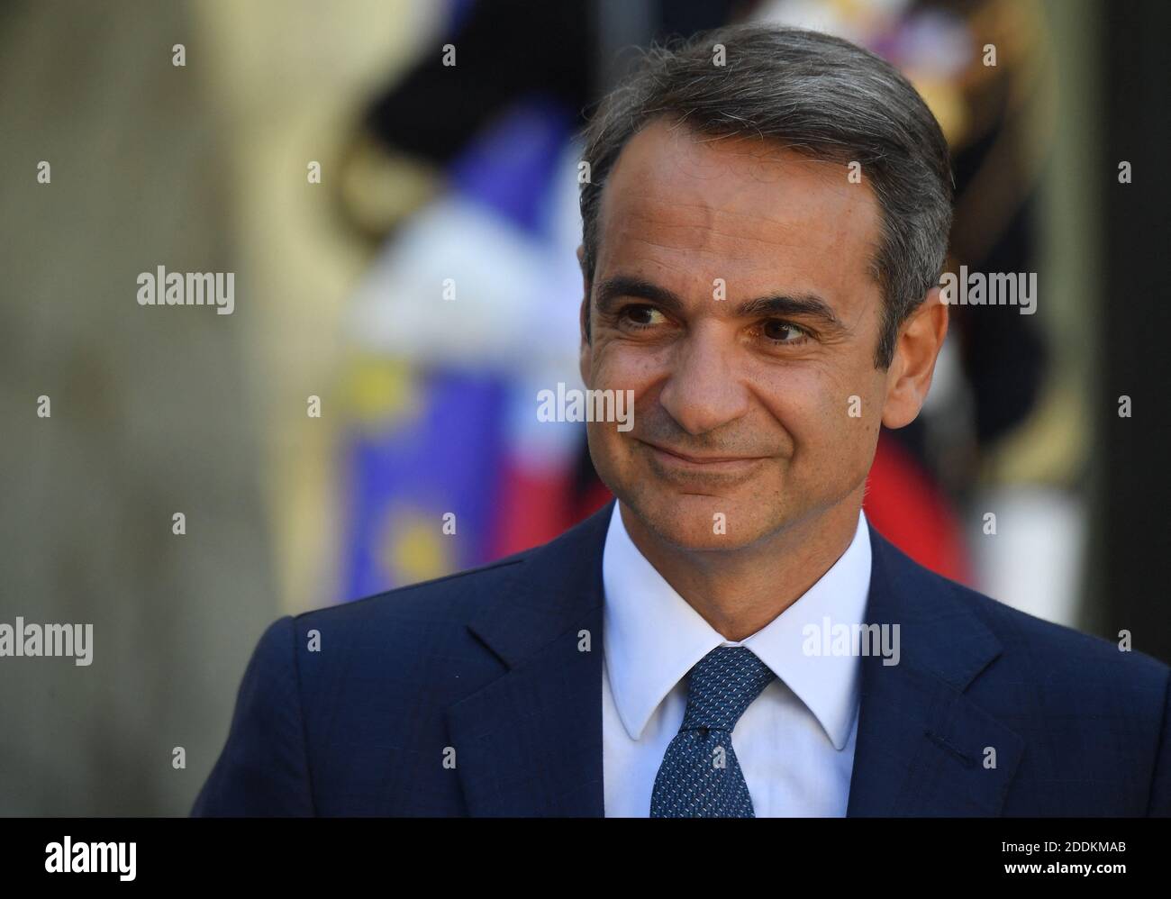 Greek Prime Minister Kyriakos Mitsotakis looks on as he arrives prior ...