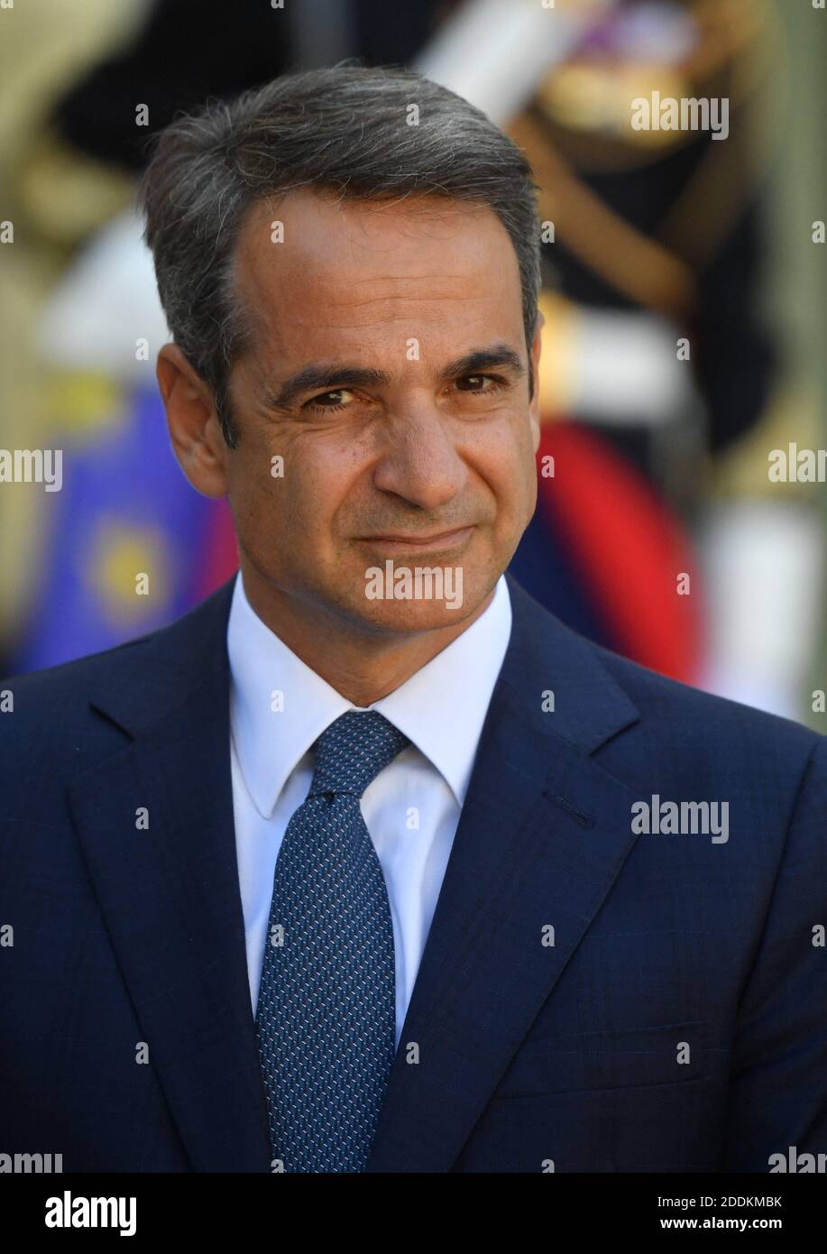 Greek Prime Minister Kyriakos Mitsotakis looks on as he arrives prior ...