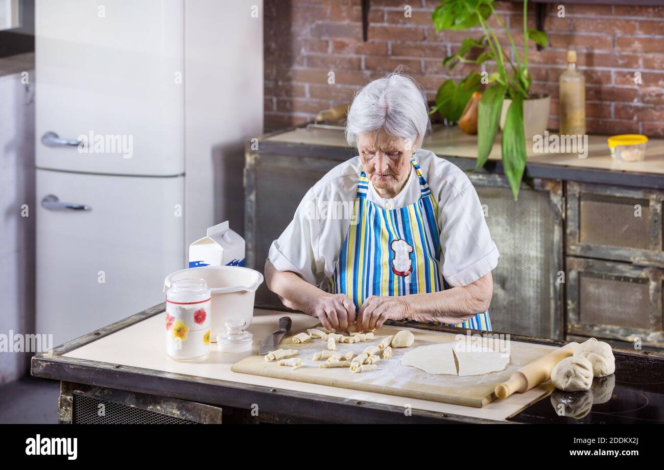 Woman making dough pastries hi-res stock photography and images - Alamy