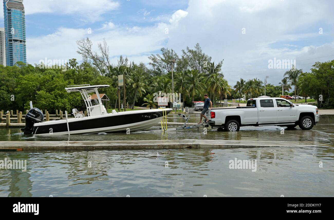 NO FILM, NO VIDEO, NO TV, NO DOCUMENTARY - People pull out their boats ...