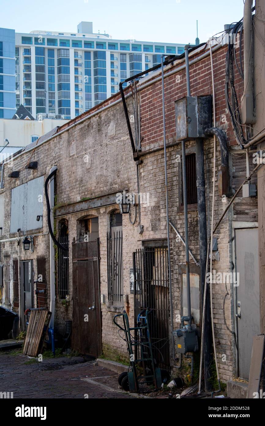 old and rustic street in the middle of a modern city Stock Photo - Alamy
