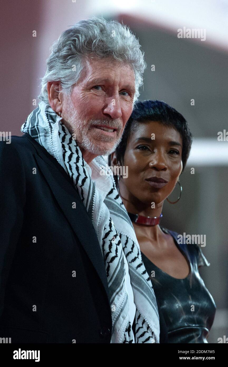 Roger Waters and guest attending the Roger Waters Us + Them Premiere as ...