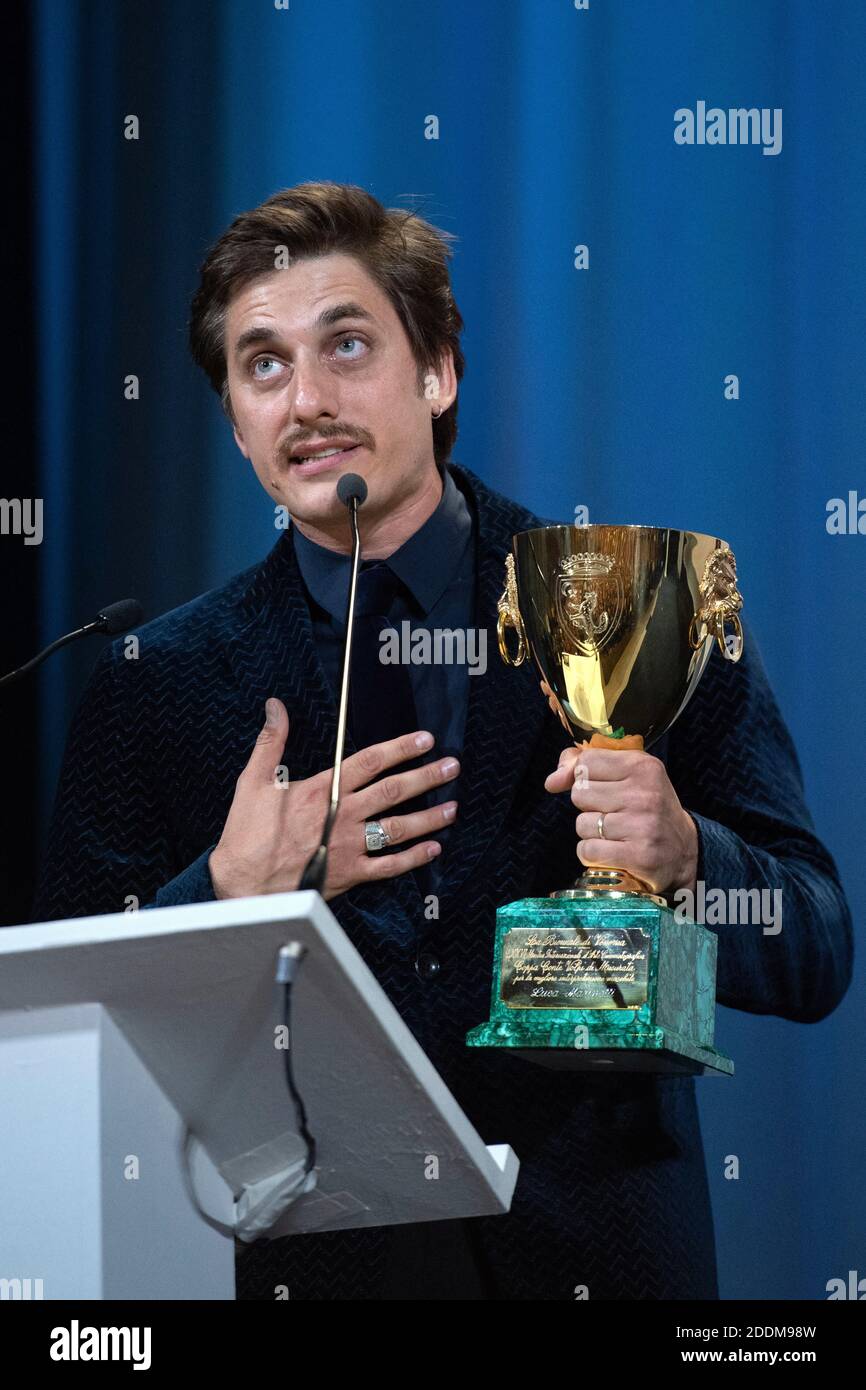 Luca Marinelli receives the Coppa Volpi for Best Actor Award for Martin ...