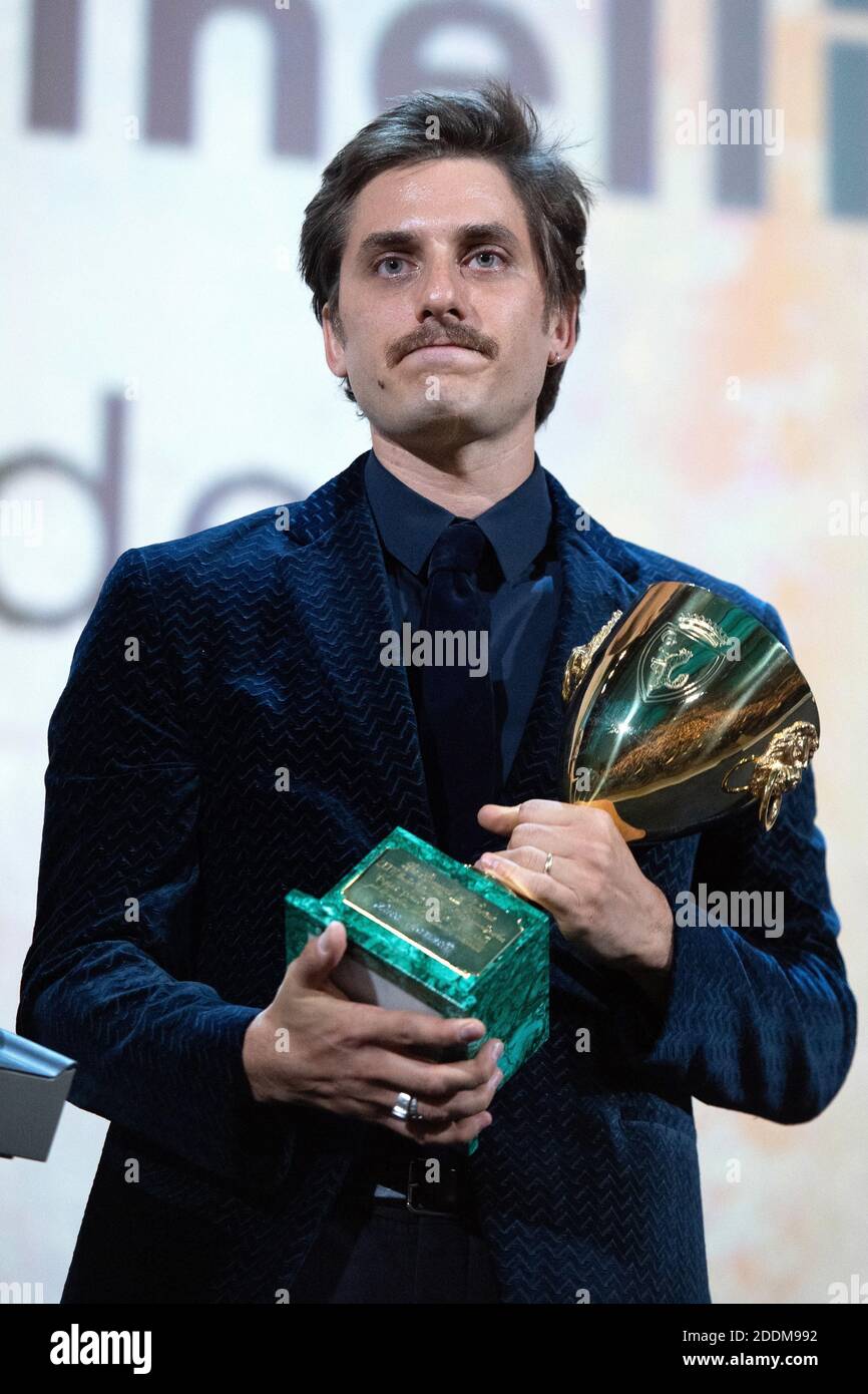 Luca Marinelli receives the Coppa Volpi for Best Actor Award for Martin ...