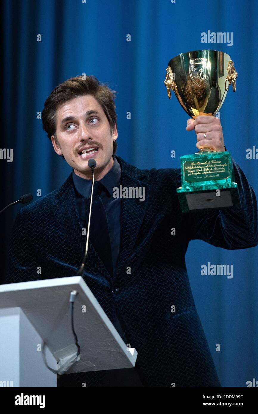Luca Marinelli receives the Coppa Volpi for Best Actor Award for Martin ...