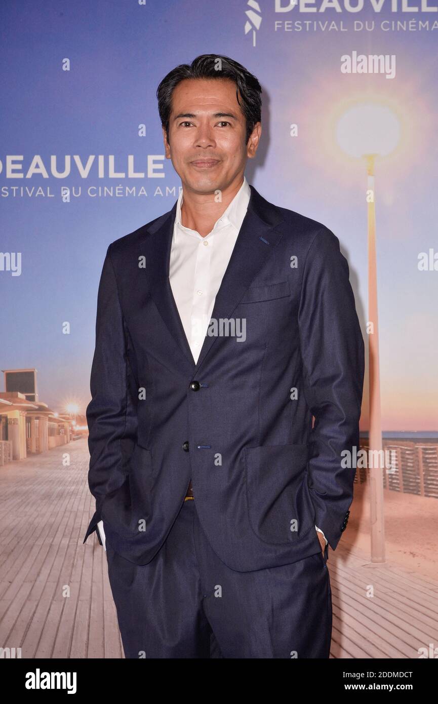 Jake Macapagal attending a photocall for the movie Watch List during ...