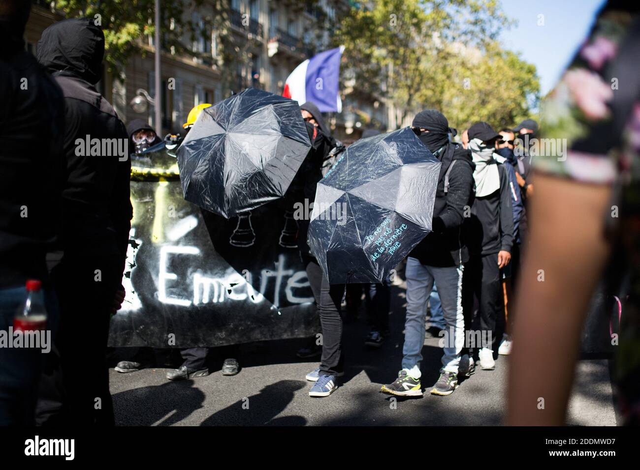Member of the black blocs holding black umbrella take part in a Climate ...