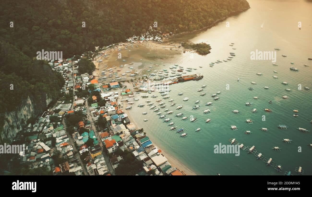 Top down slow motion aerial cityscape with lodges, homes, buildings ...