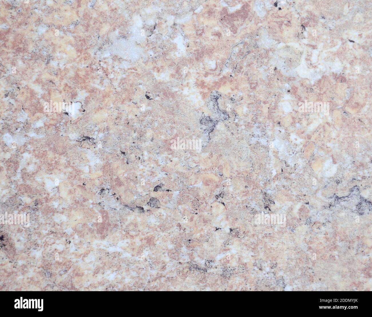 Pale pink marble interspersed with black and gray colors, close-up of a ...