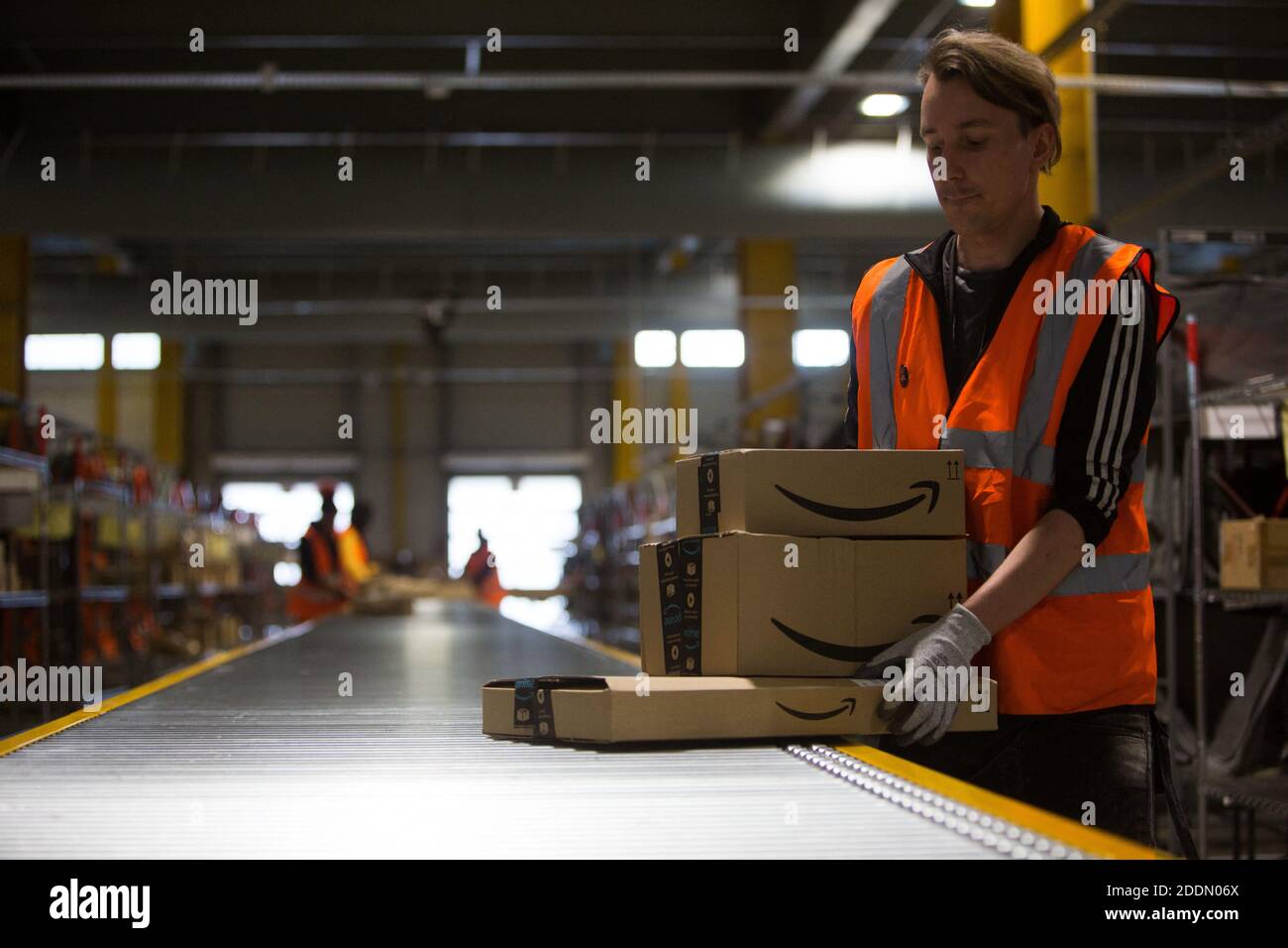 Staff and employees working in the logistic warehouse of Amazon in ...