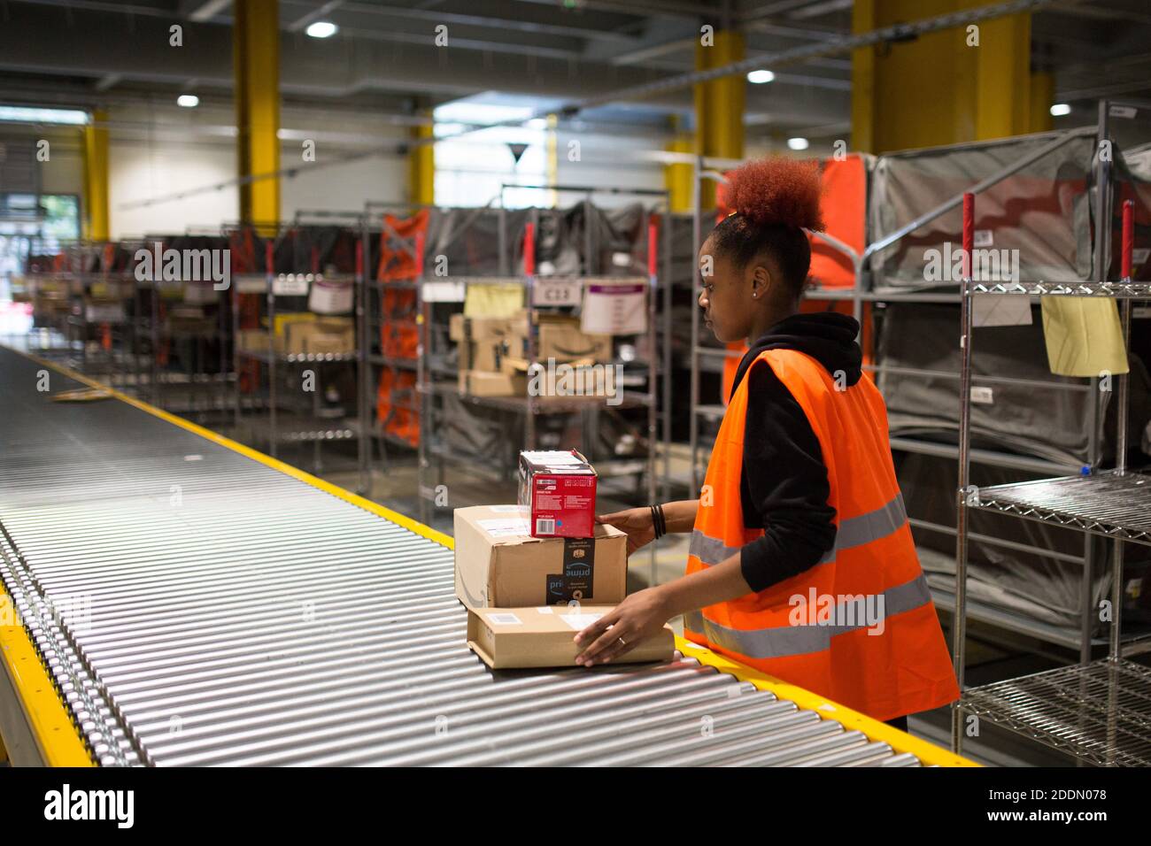 Staff and employees working in the logistic warehouse of Amazon in ...