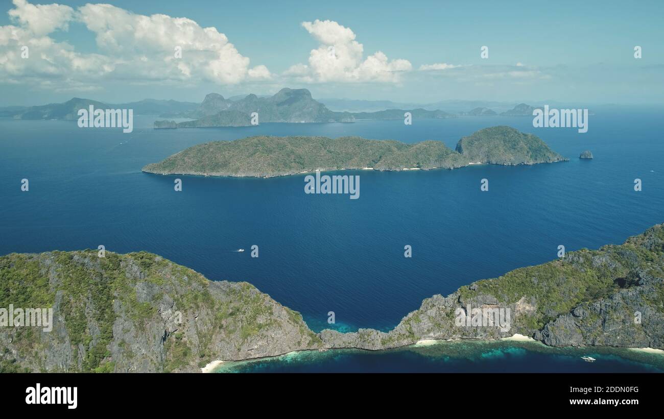 Hilly island at sea bay aerial shot. Epic landscape of green forest ...