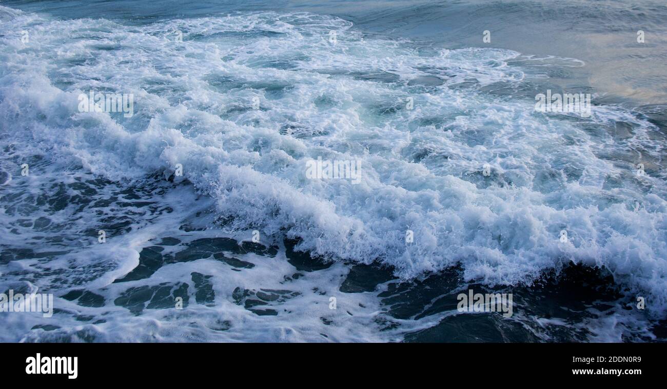 Sea water foaming wave background Stock Photo - Alamy