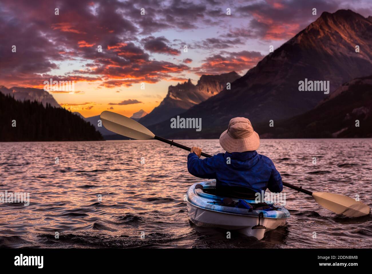 Adventurous Man Kayaking in Glacier Lake Stock Photo - Alamy