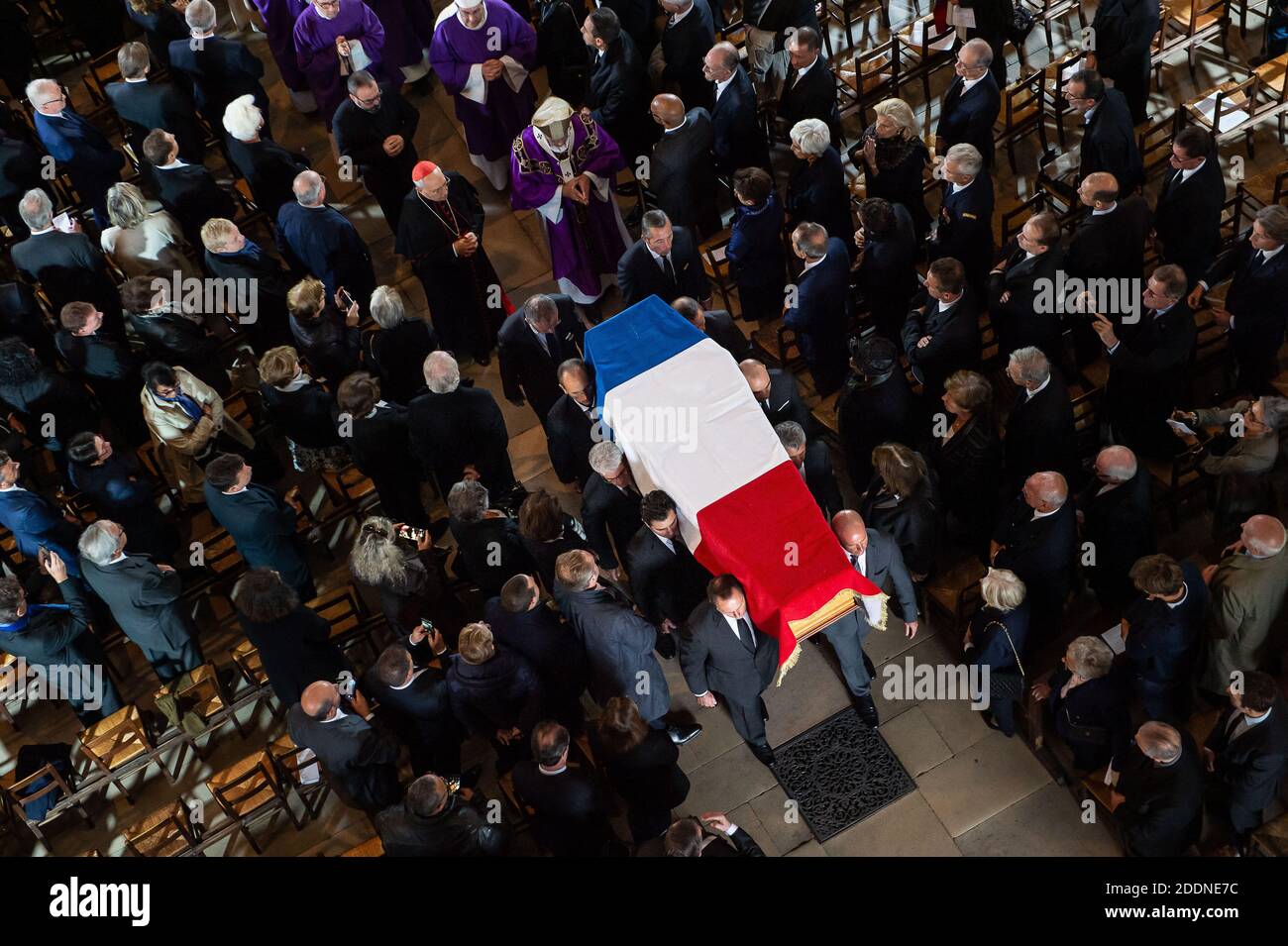 The coffin of the late French president Jacques Chirac is carried out ...