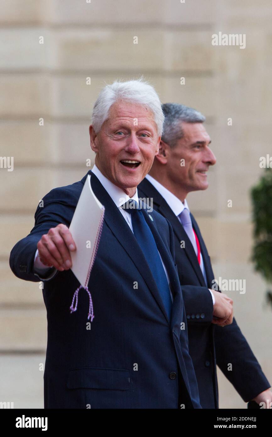 Former US President Bill Clinton gesture and smile as he leaves The ...