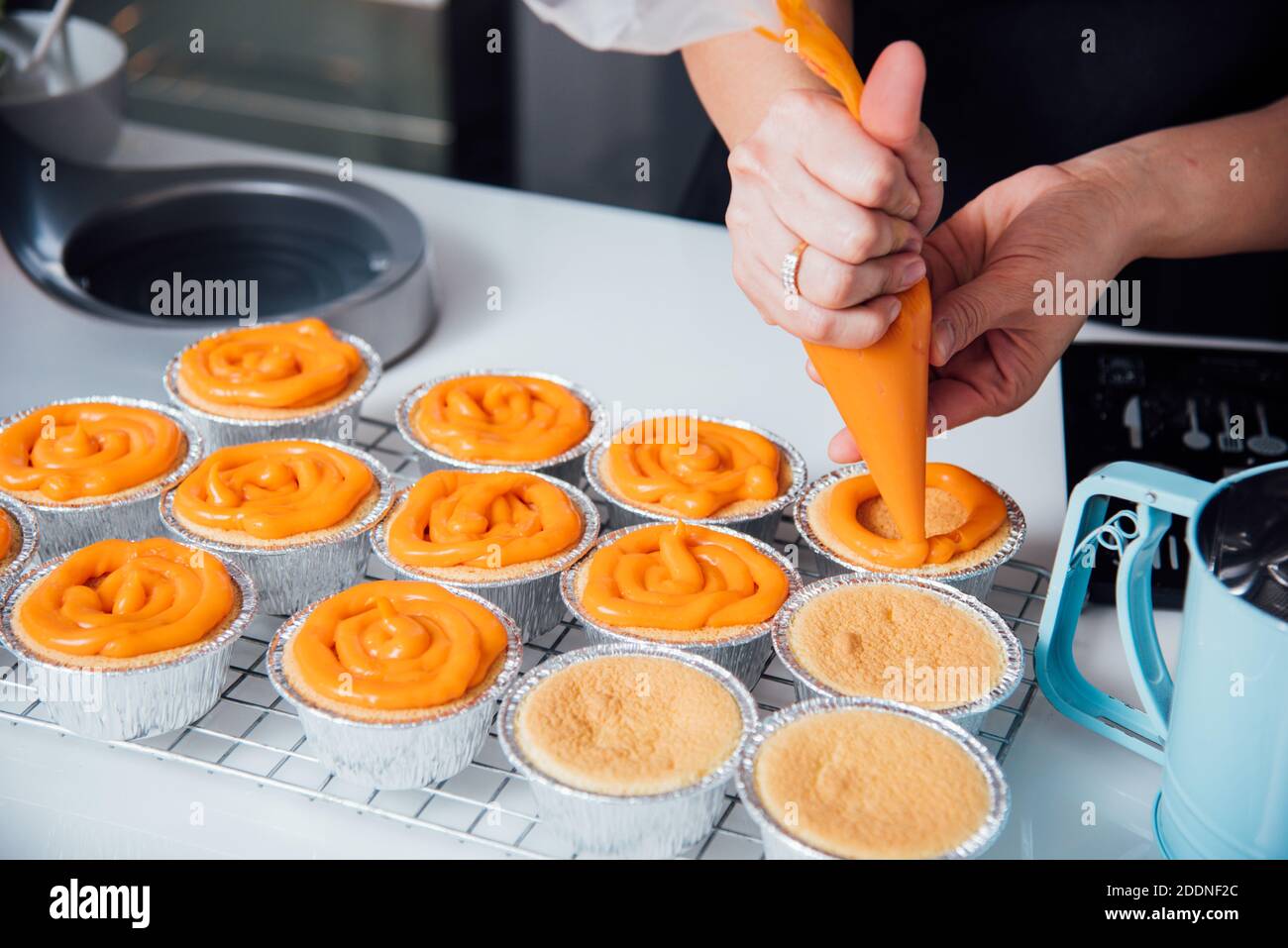 Woman during making decorating cooking bakery cake at homemade Stock ...