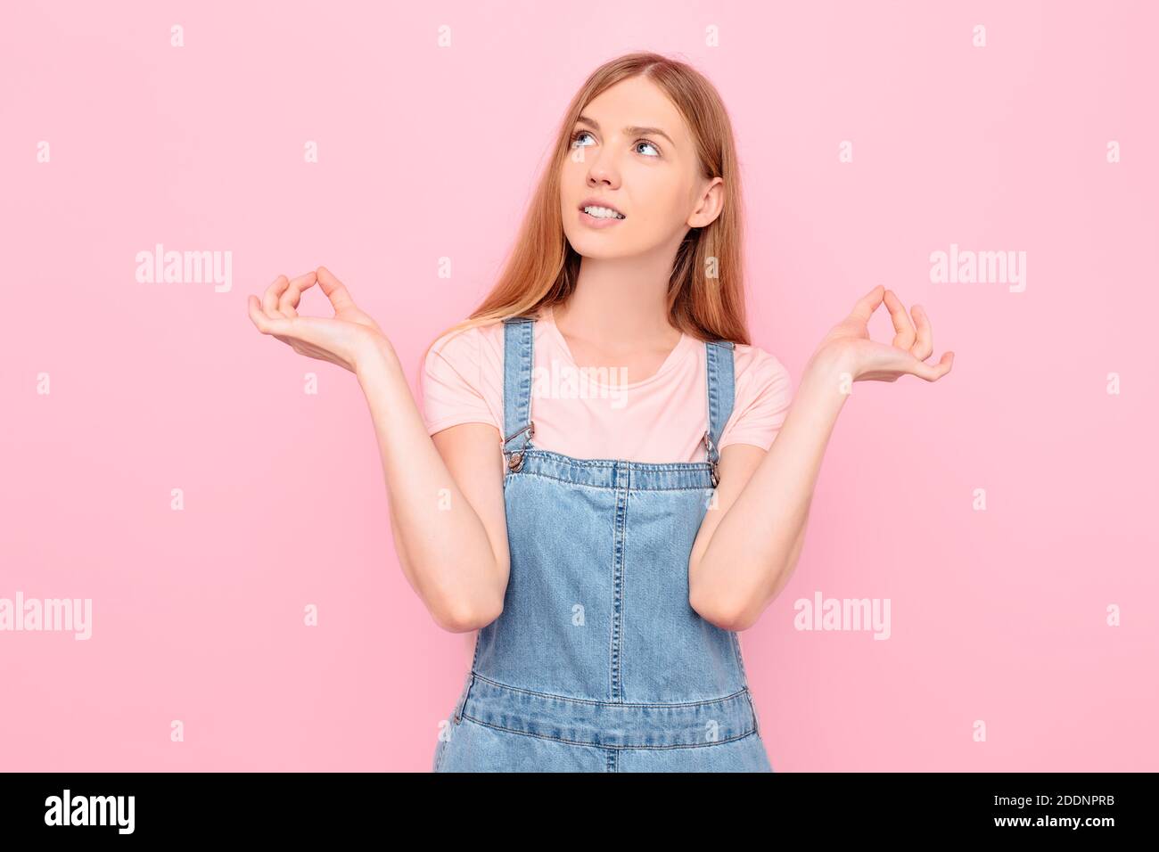 Calm, relaxed pretty young girl relieves stress, closes her eyes and ...