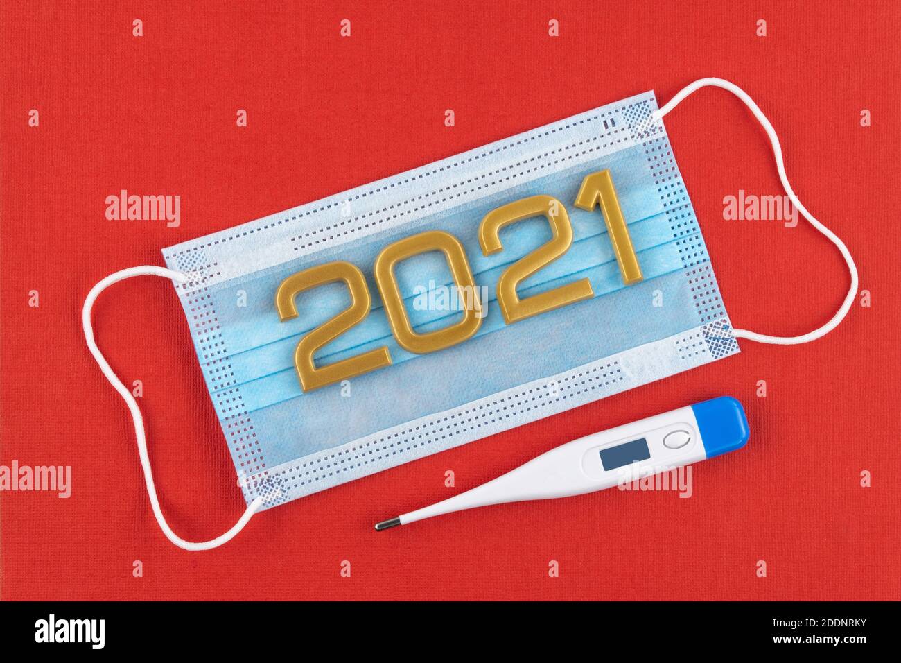 medical mask and numbers 2021 on a red background. Surgical protective ...