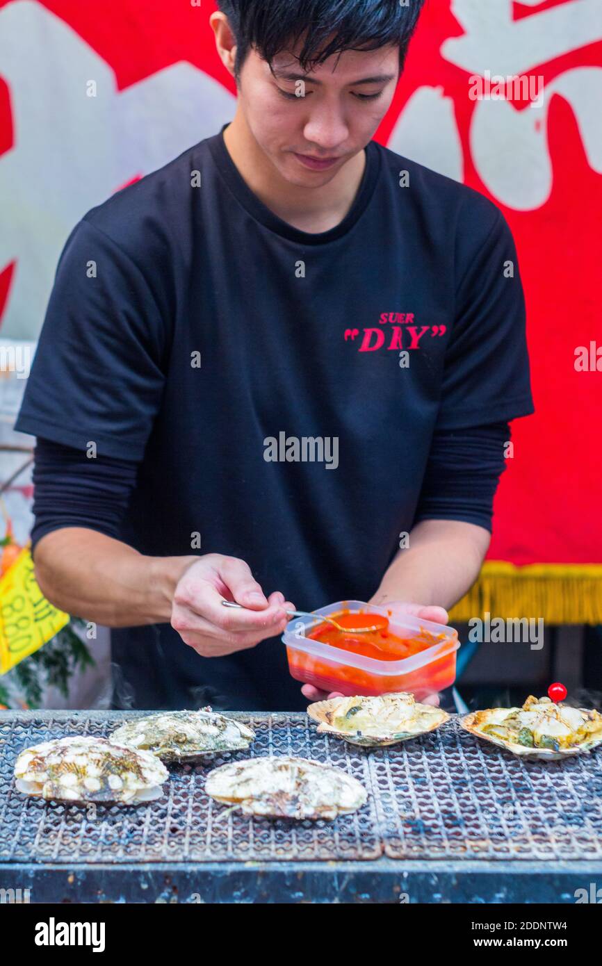 Grilled and torched scallops at the Kuromon Ichiban market in Osaka ...